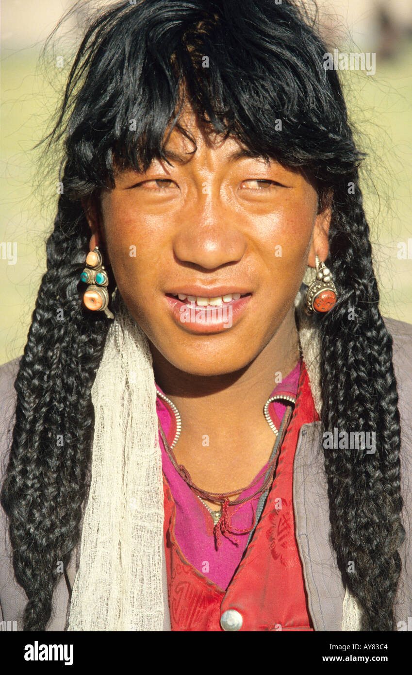 Tibetan male Nomad with traditionally plaited hair and earings at Naqu ...