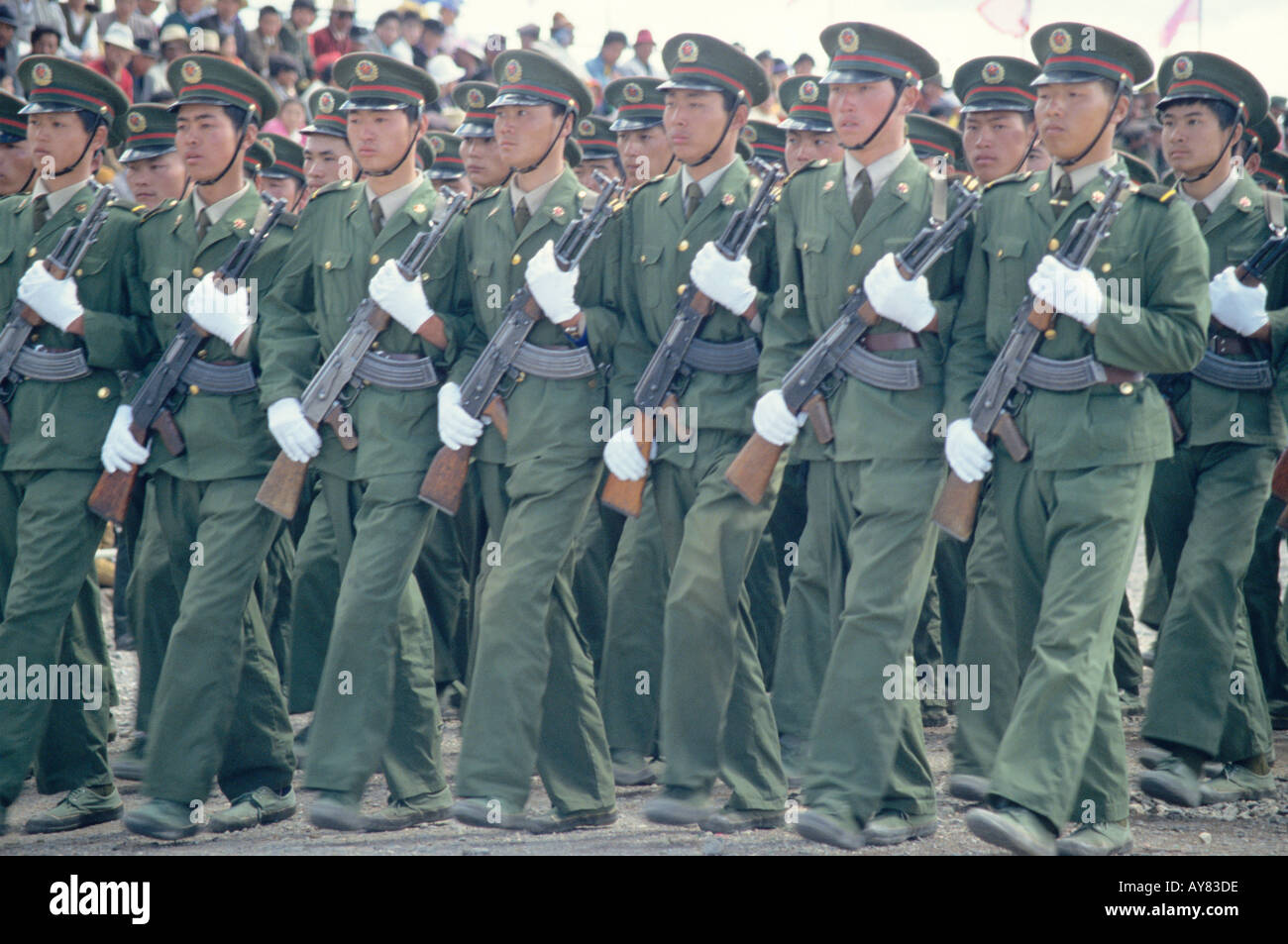 Chinese soldiers with guns parade at Tibetan traditional horse fair ...