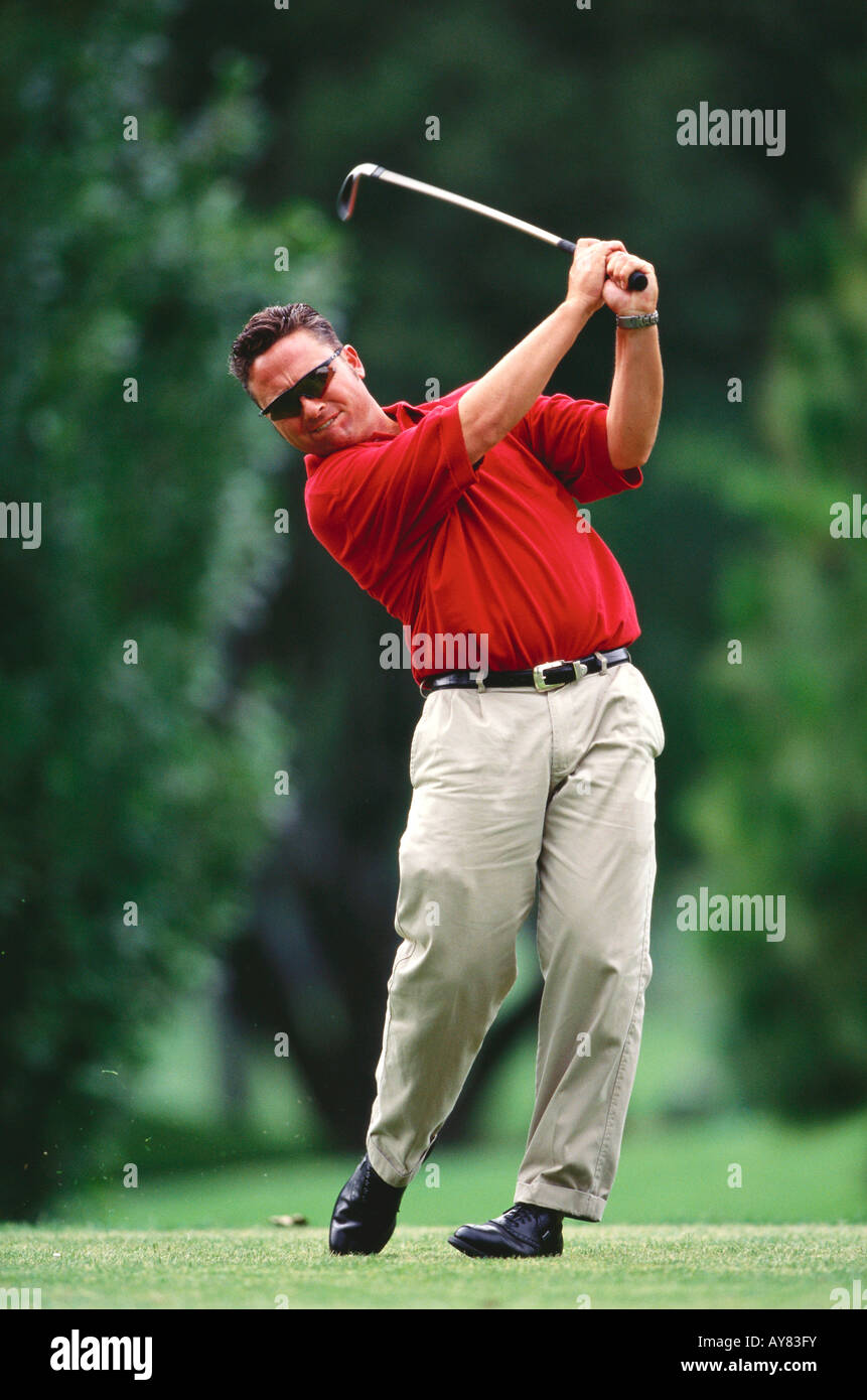 Male golfer in action Stock Photo - Alamy