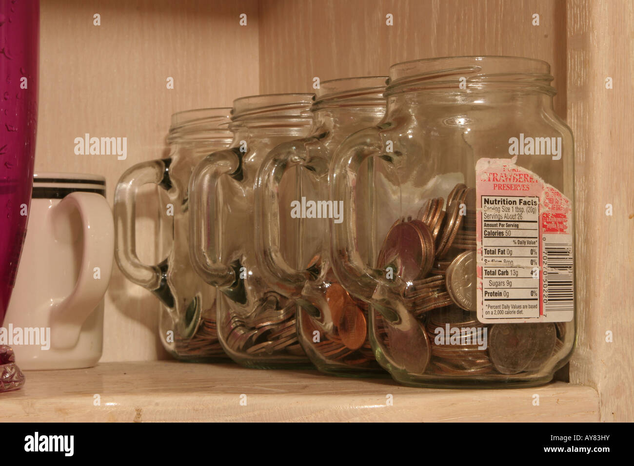 jars of loose change Stock Photo - Alamy
