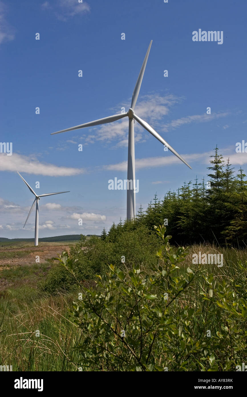 Wind power turbines on windfarm producing electricity for part of ...