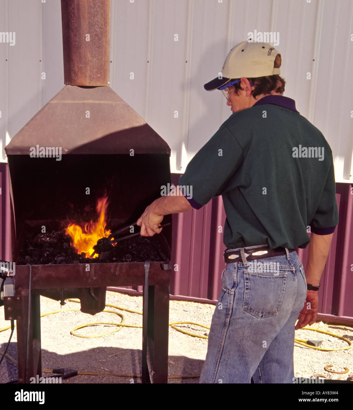 Adult male man american blacksmith forge fire making horseshoes hi-res ...