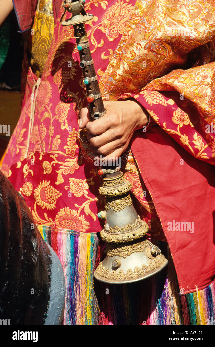 Buddhist musician monk holds highly decorated traditional horn trumpet ...
