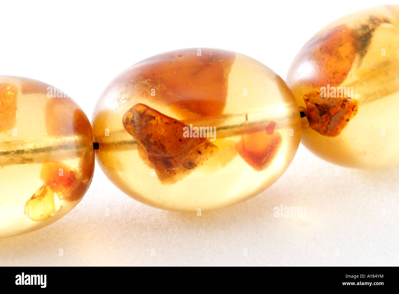 Amber on white background show their own structure Stock Photo - Alamy