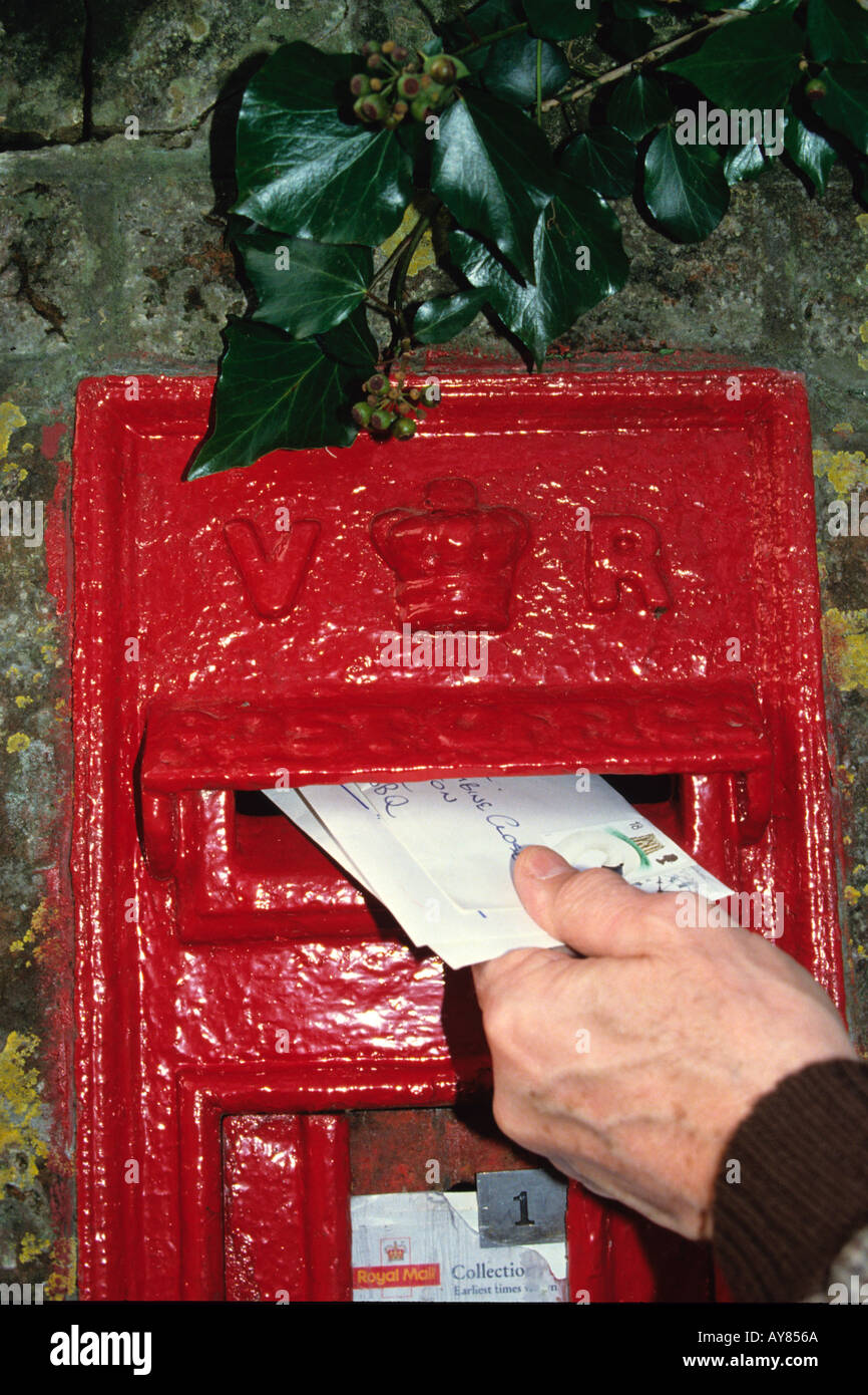 hand posting a letter in red British postbox Stock Photo - Alamy hand posting a letter in red British postbox Stock Photo - Alamy