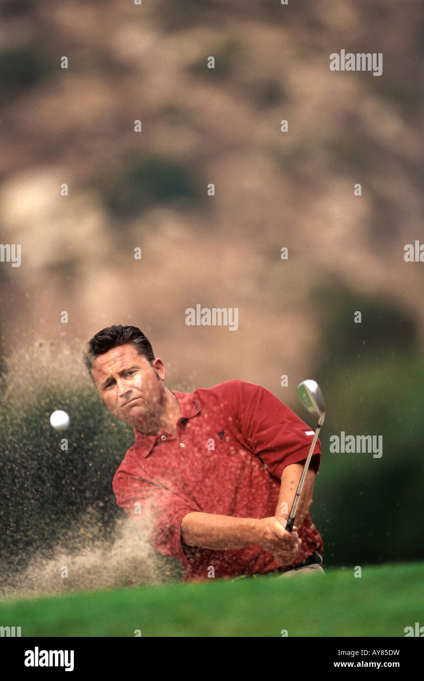 Male golfer in action Stock Photo - Alamy