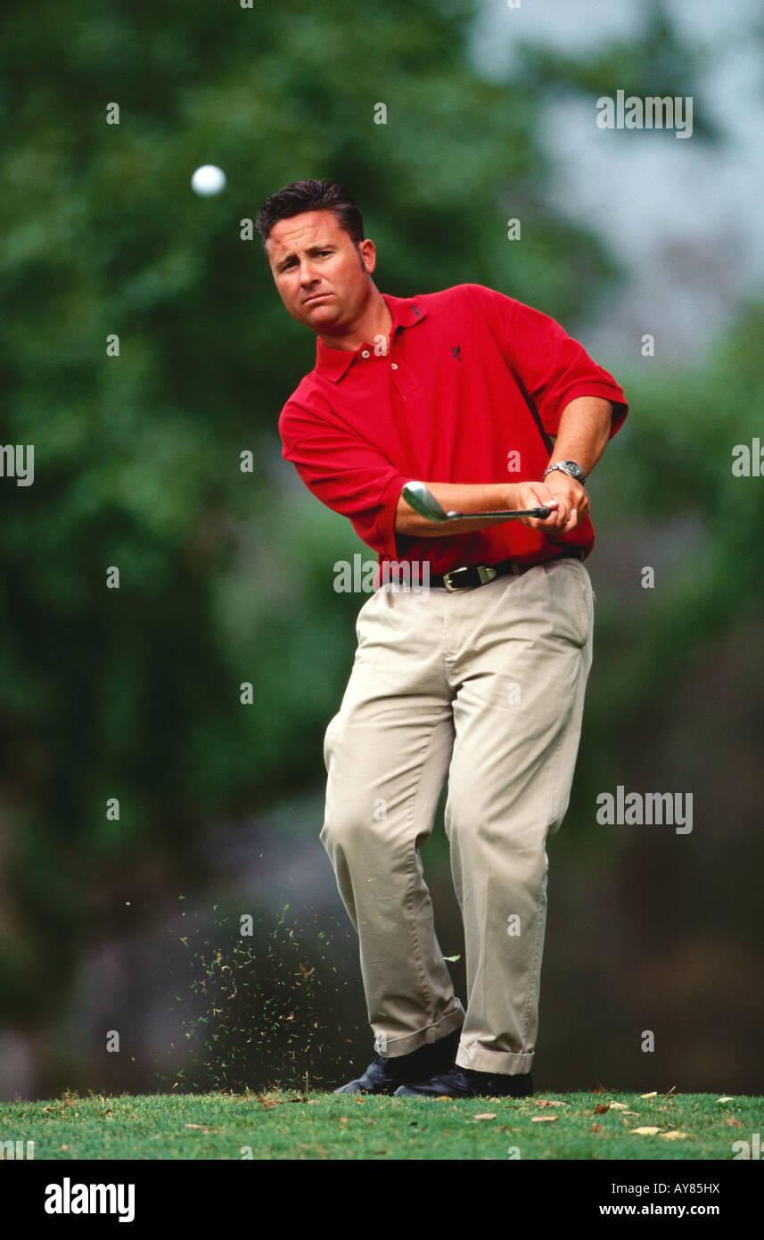 Male golfer in action Stock Photo - Alamy