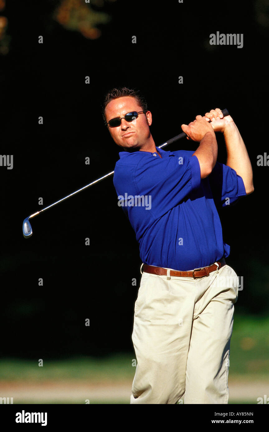 Male golfer in action Stock Photo - Alamy