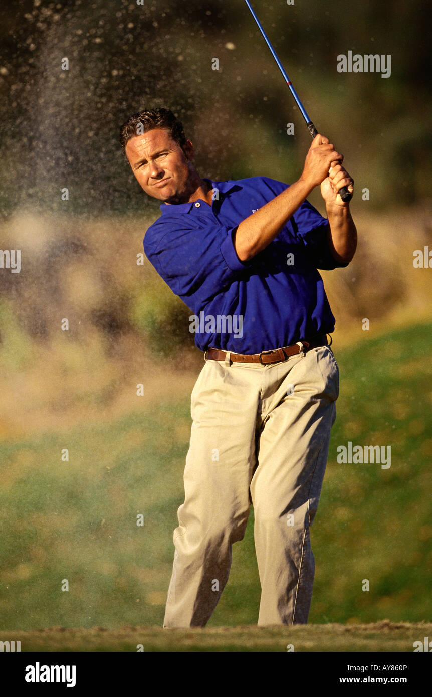 Male golfer in action Stock Photo - Alamy
