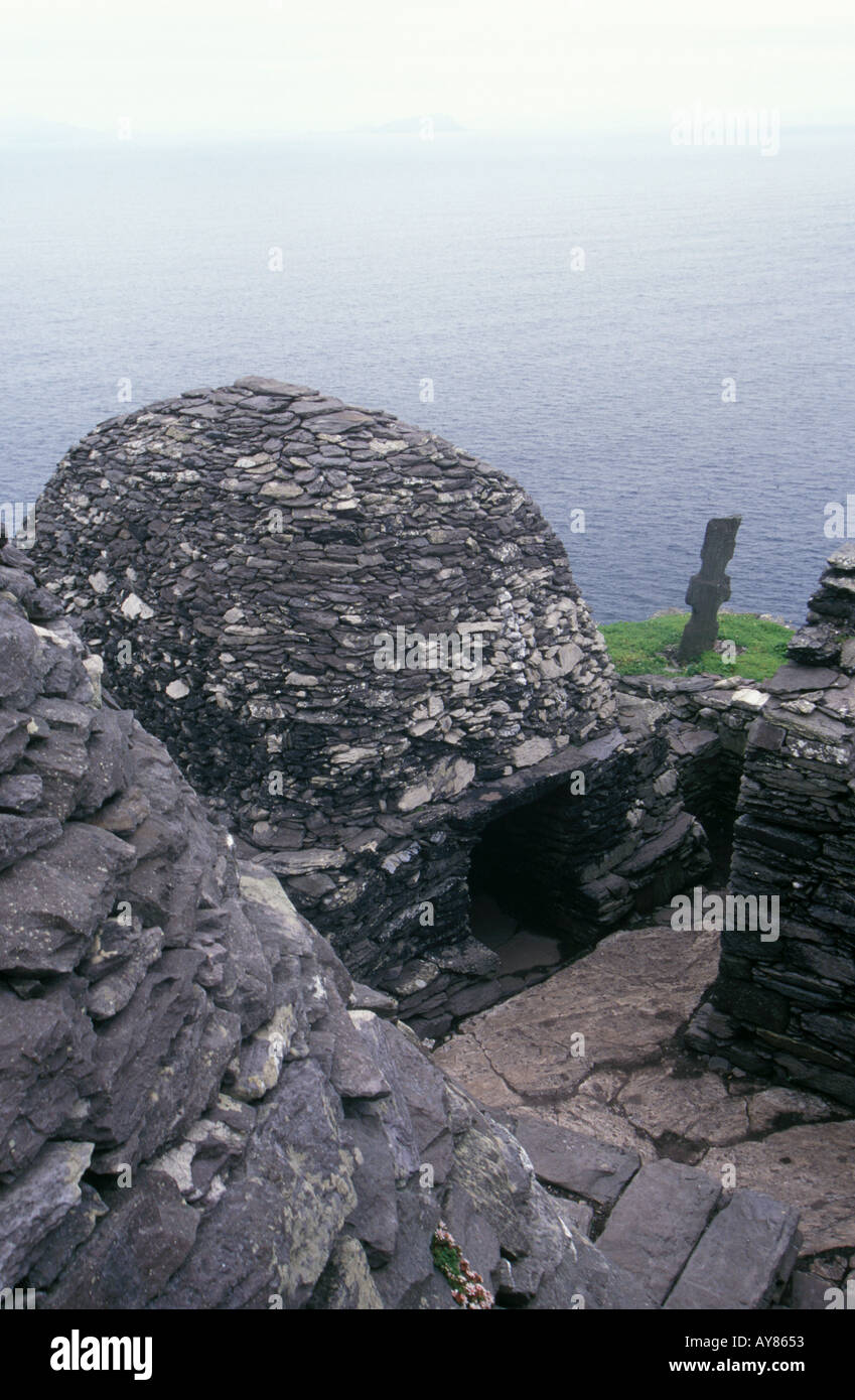 Beehive huts and remains of cross on Skellig Islands County Kerry ...