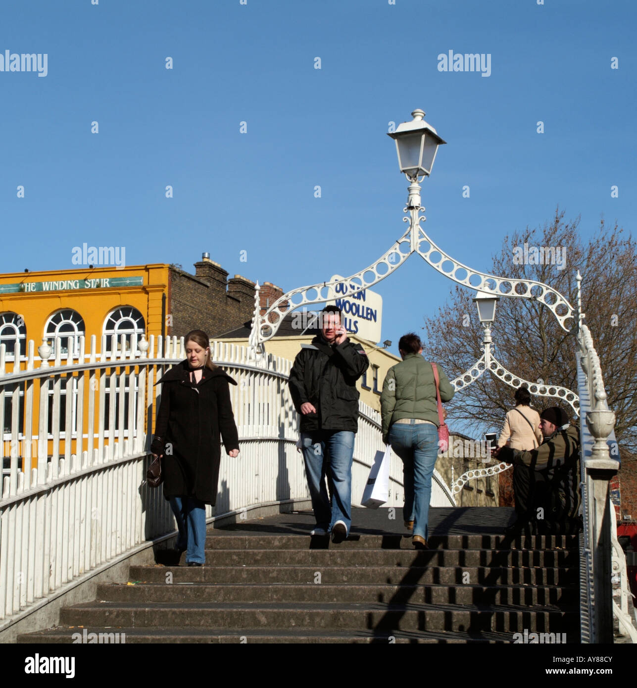 Pedestrian Halfpenny Bridge which crosses the River Liffey in Dublin ...