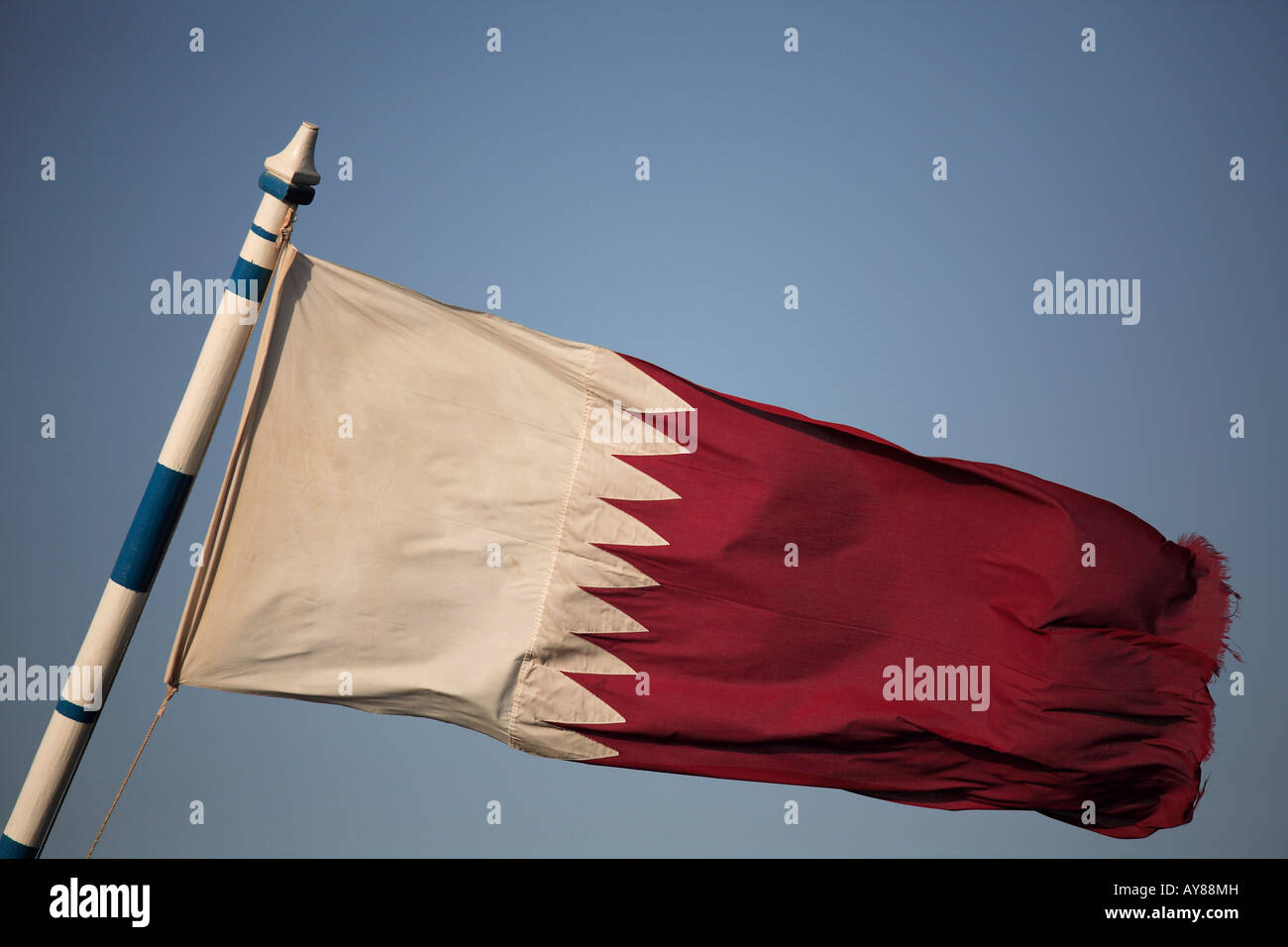 Qatar Doha Qatari national flag Stock Photo - Alamy
