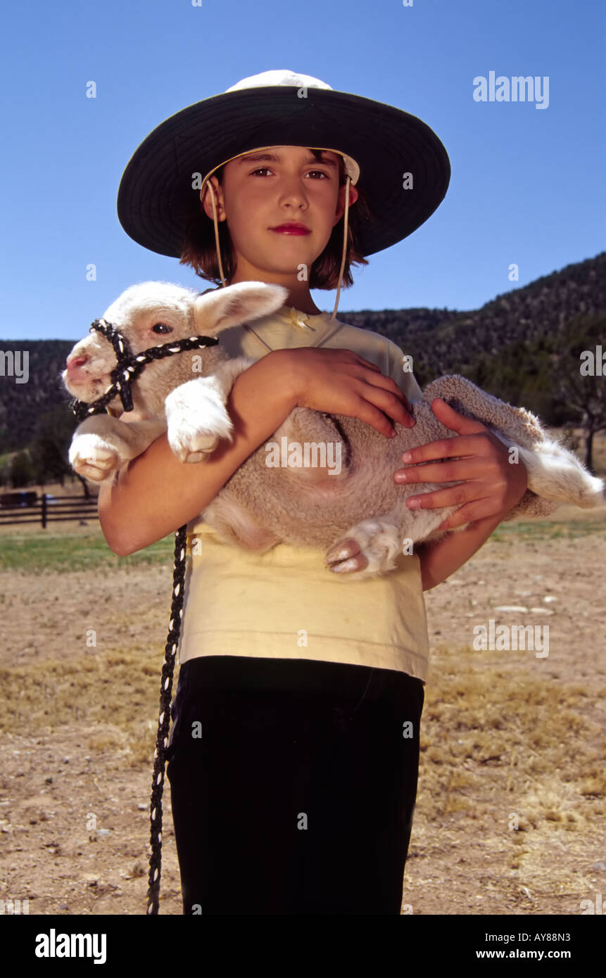 MR 534 Afton Sullivan learns how to care for a baby lamb at the Fiber ...