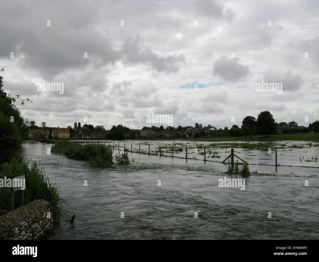 View of the River Coln flooding into the adjacent field shot from the ...