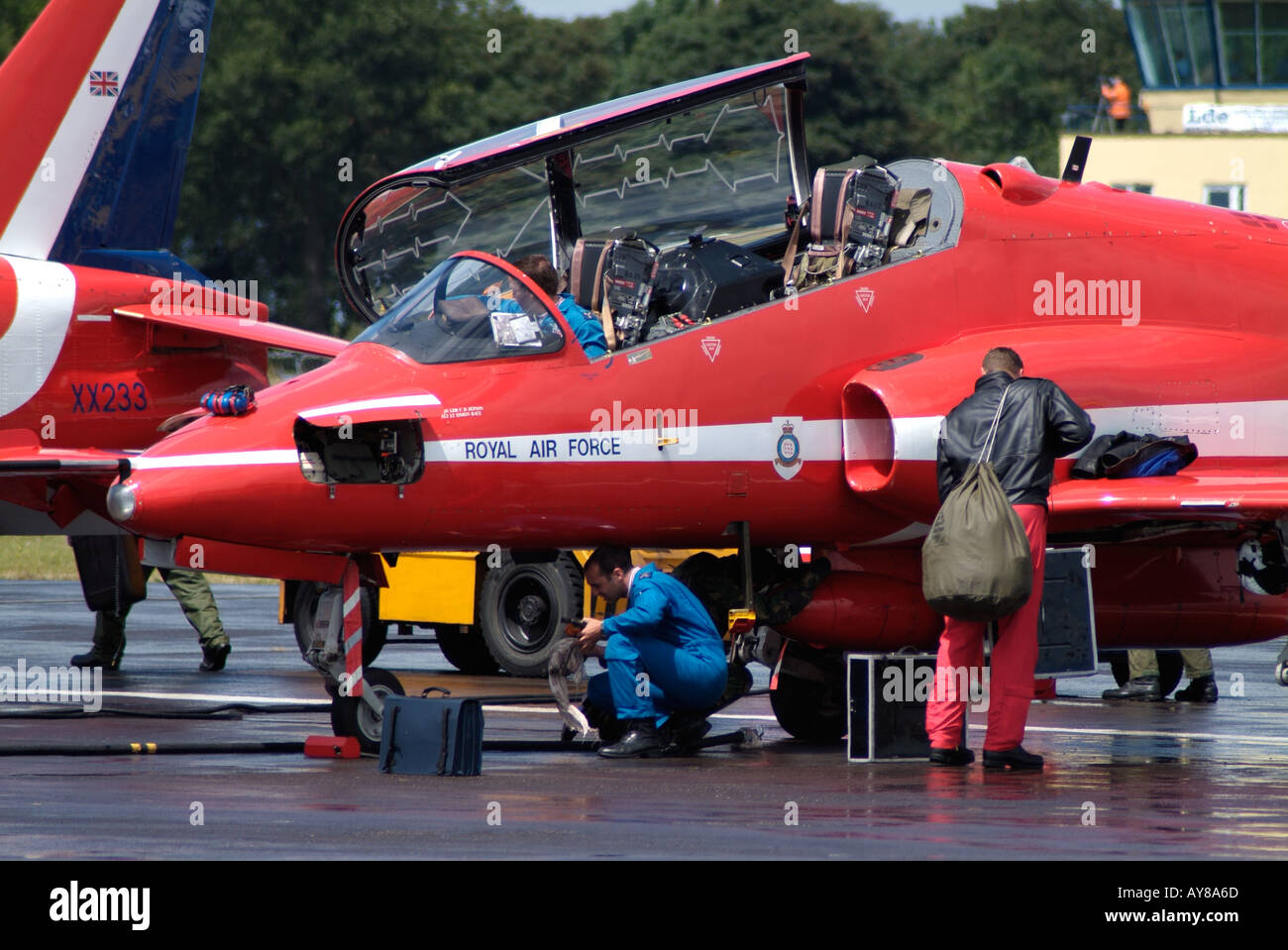 Mechanics working on a Red Arrows Hawk Jet Stock Photo - Alamy