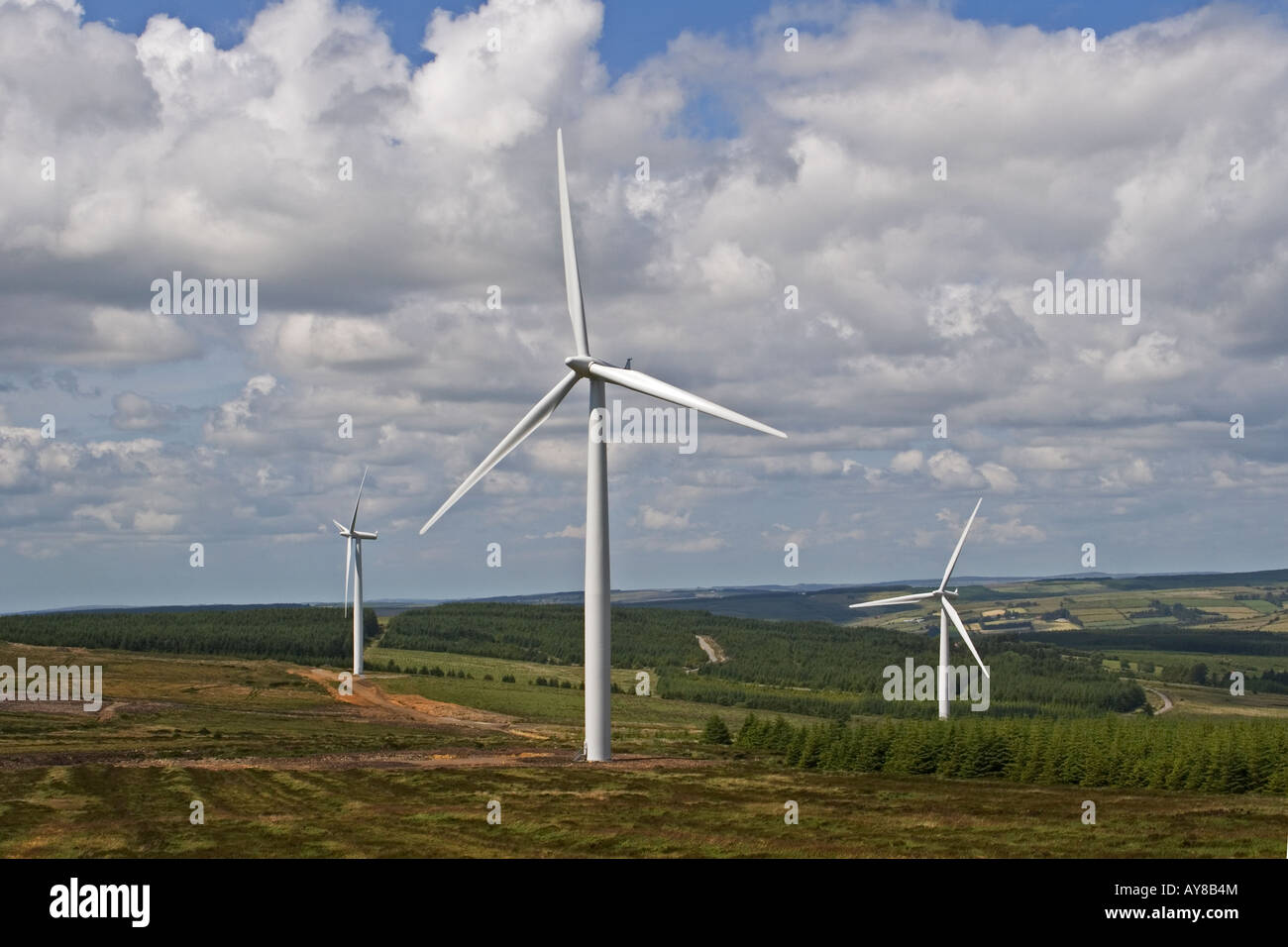 Wind power turbines on windfarm producing electricity for part of ...