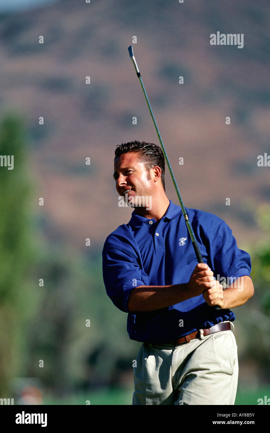 Male golfer in action Stock Photo - Alamy