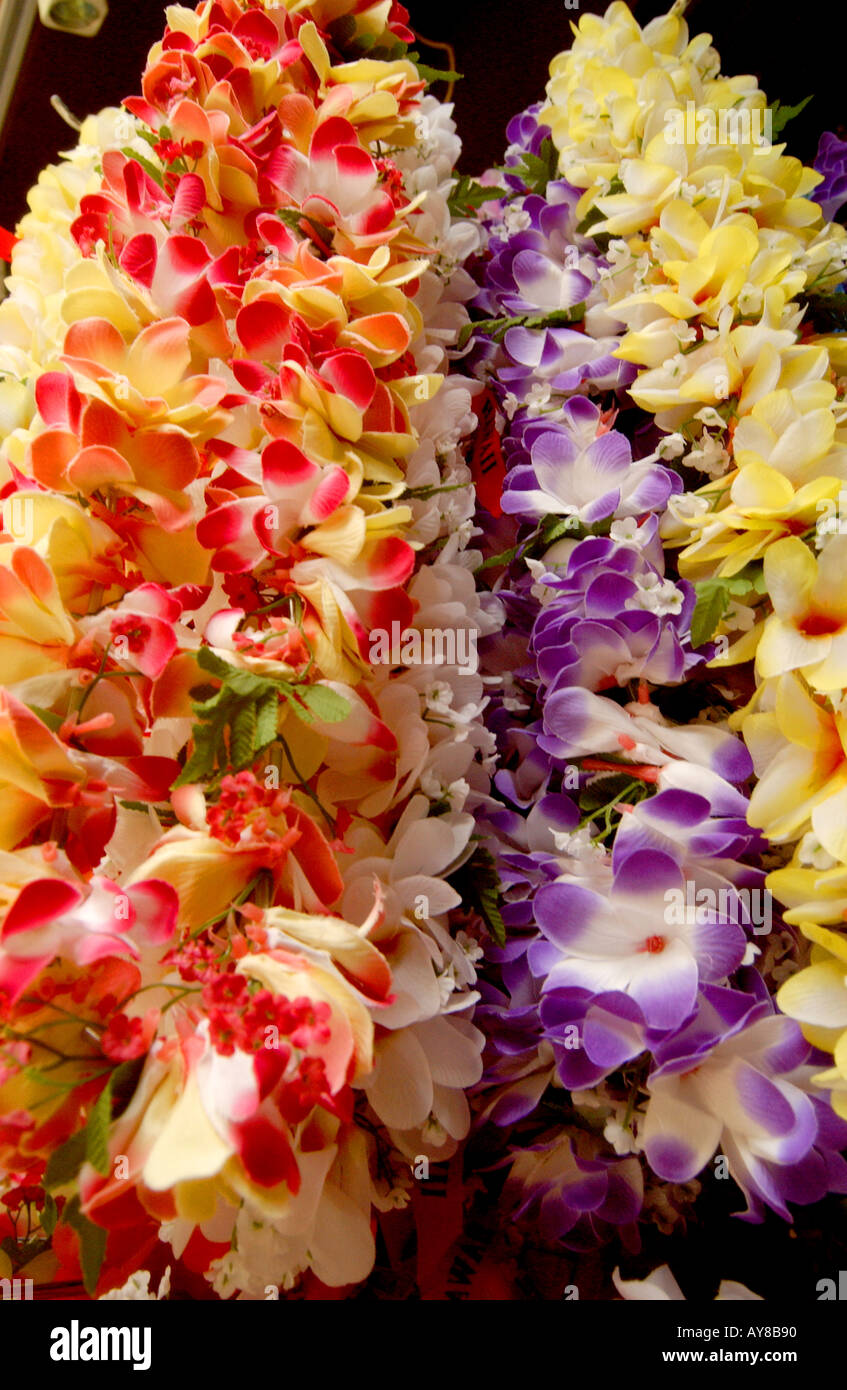 Color image of brightly color lei s on display at a shop in Waikiki on ...