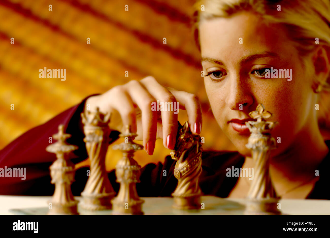 Portrait of a woman playing chess hi-res stock photography and images ...
