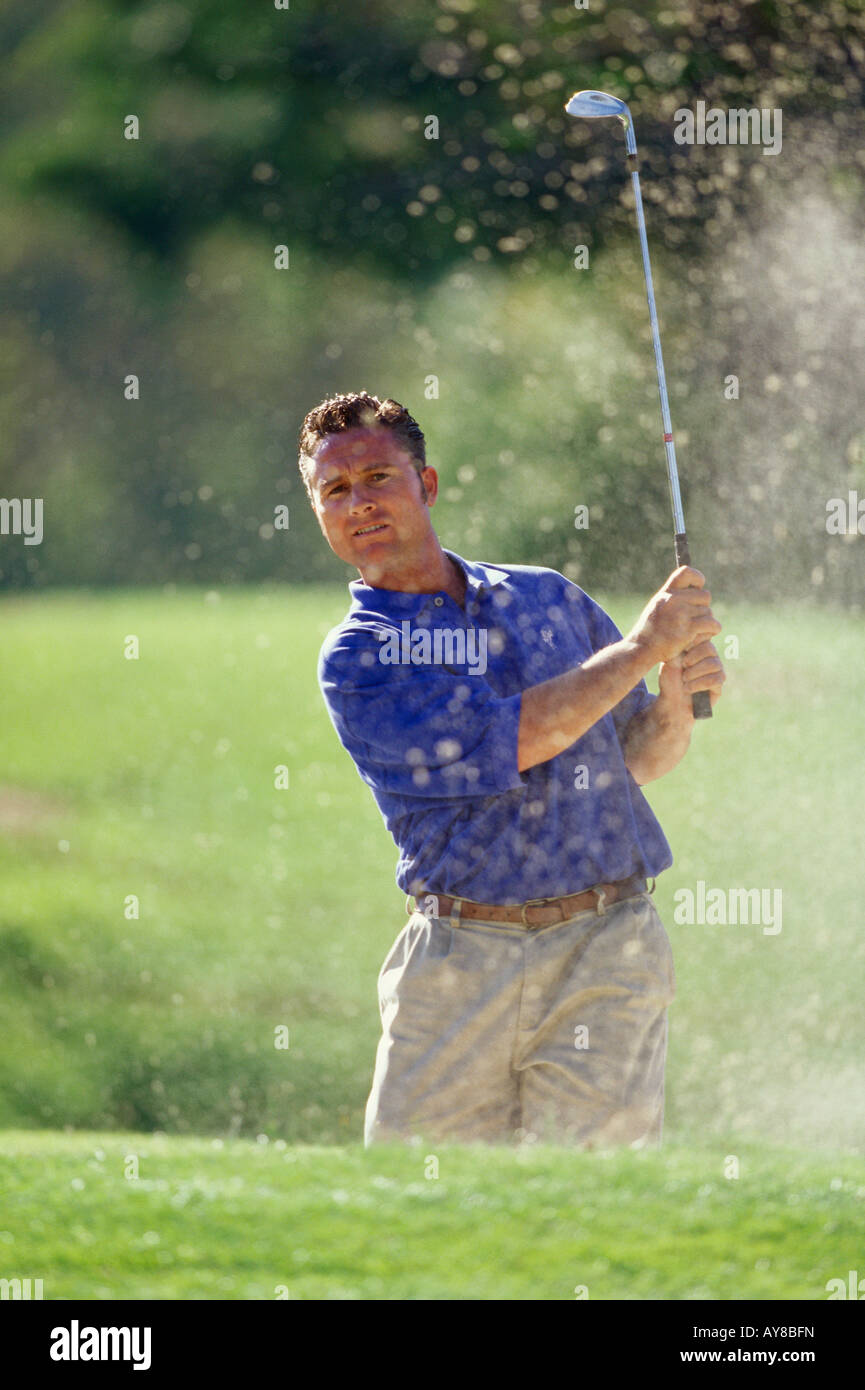 Male golfer in action Stock Photo - Alamy