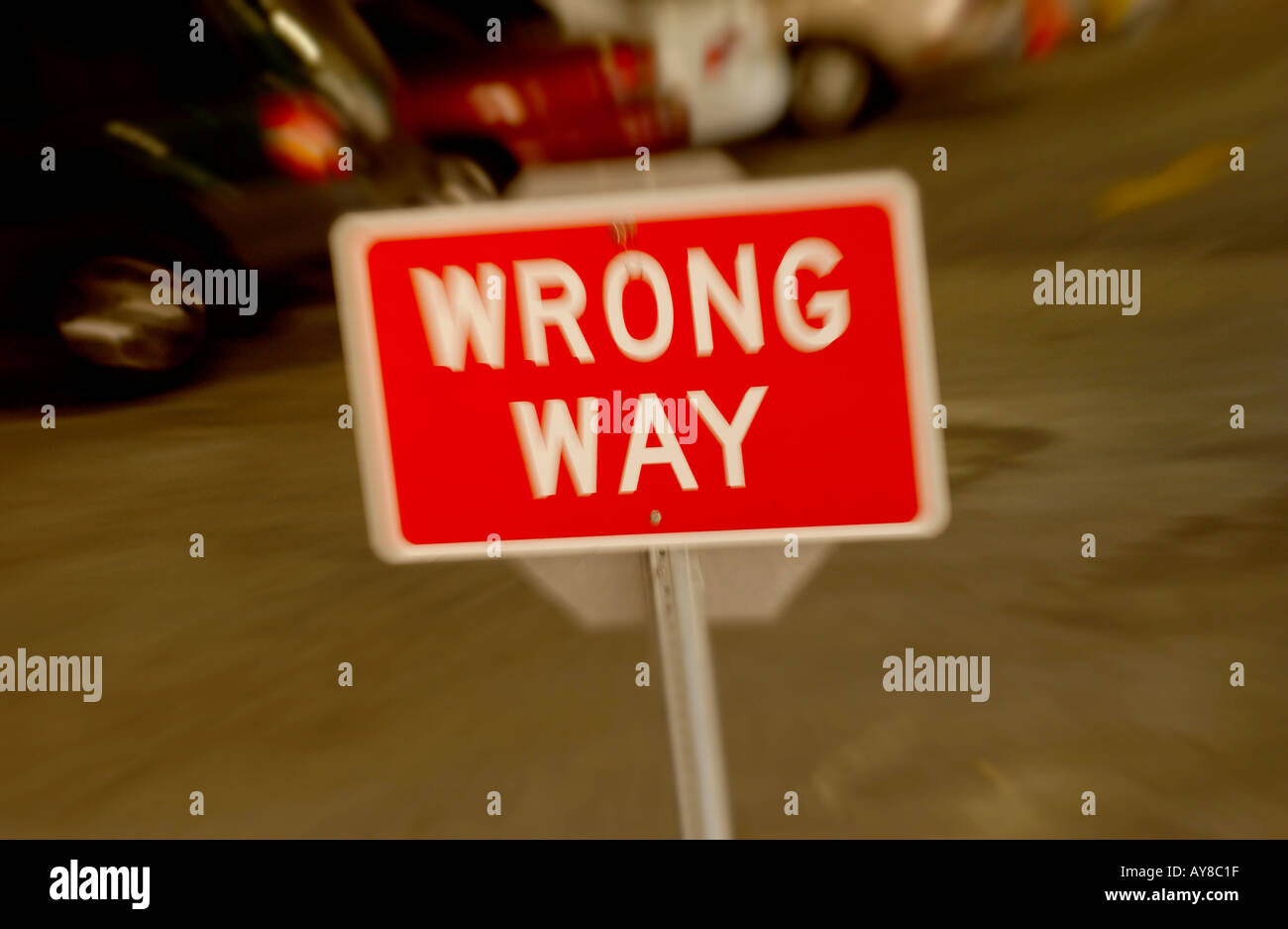 Horizontal color image of a wrong way sign along a public road or ...