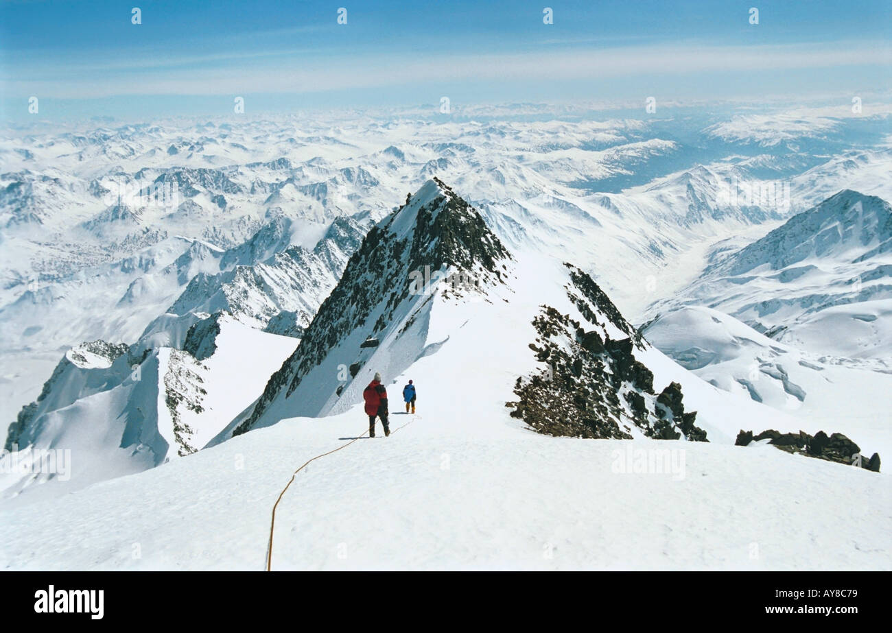 Mountain climbers are moving along the Belukhinskiy Pass The Belukha ...
