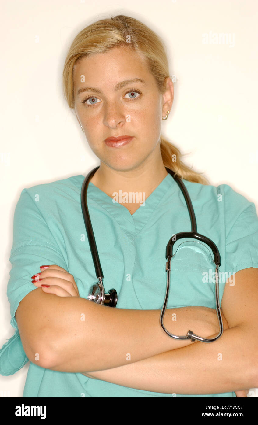 Vertical color image of an attractive blonde female nurse or doctor ...