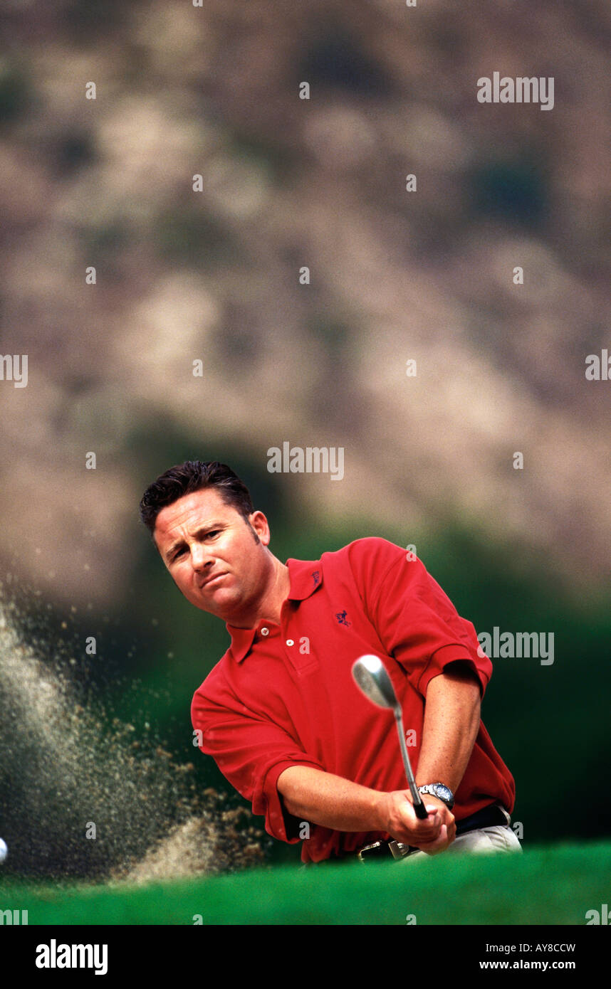Male golfer in action Stock Photo - Alamy