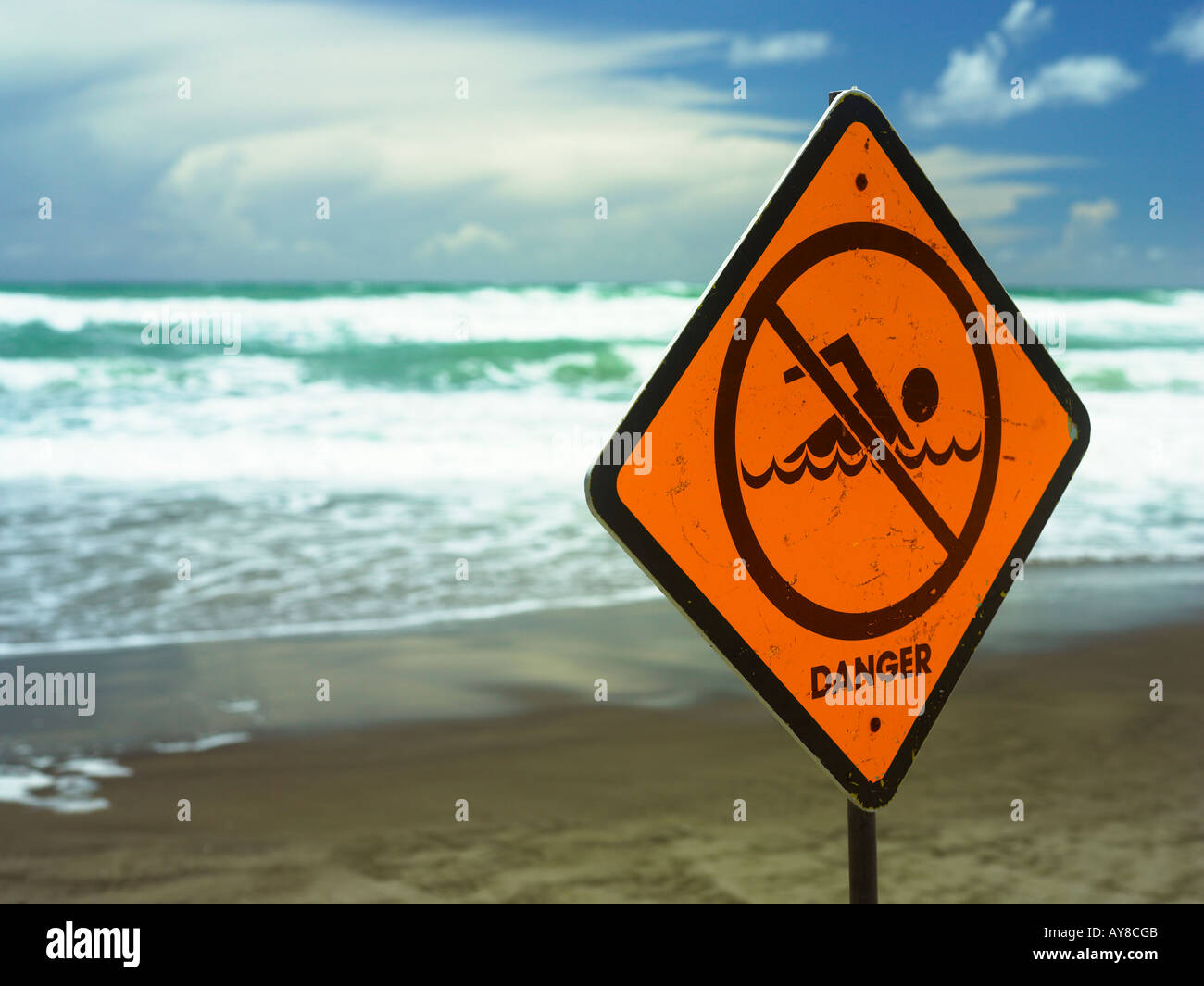 warning sign for swimming on beach with stormy sea Stock Photo - Alamy