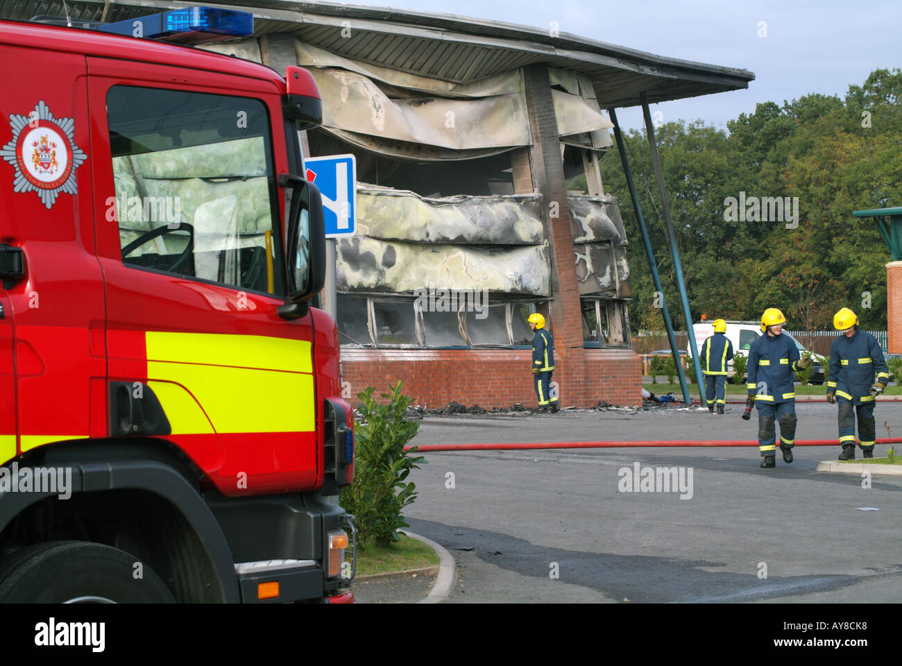 FIREMAN FIGHTING FIRE AT A FACTORY IN ENGLAND Stock Photo - Alamy