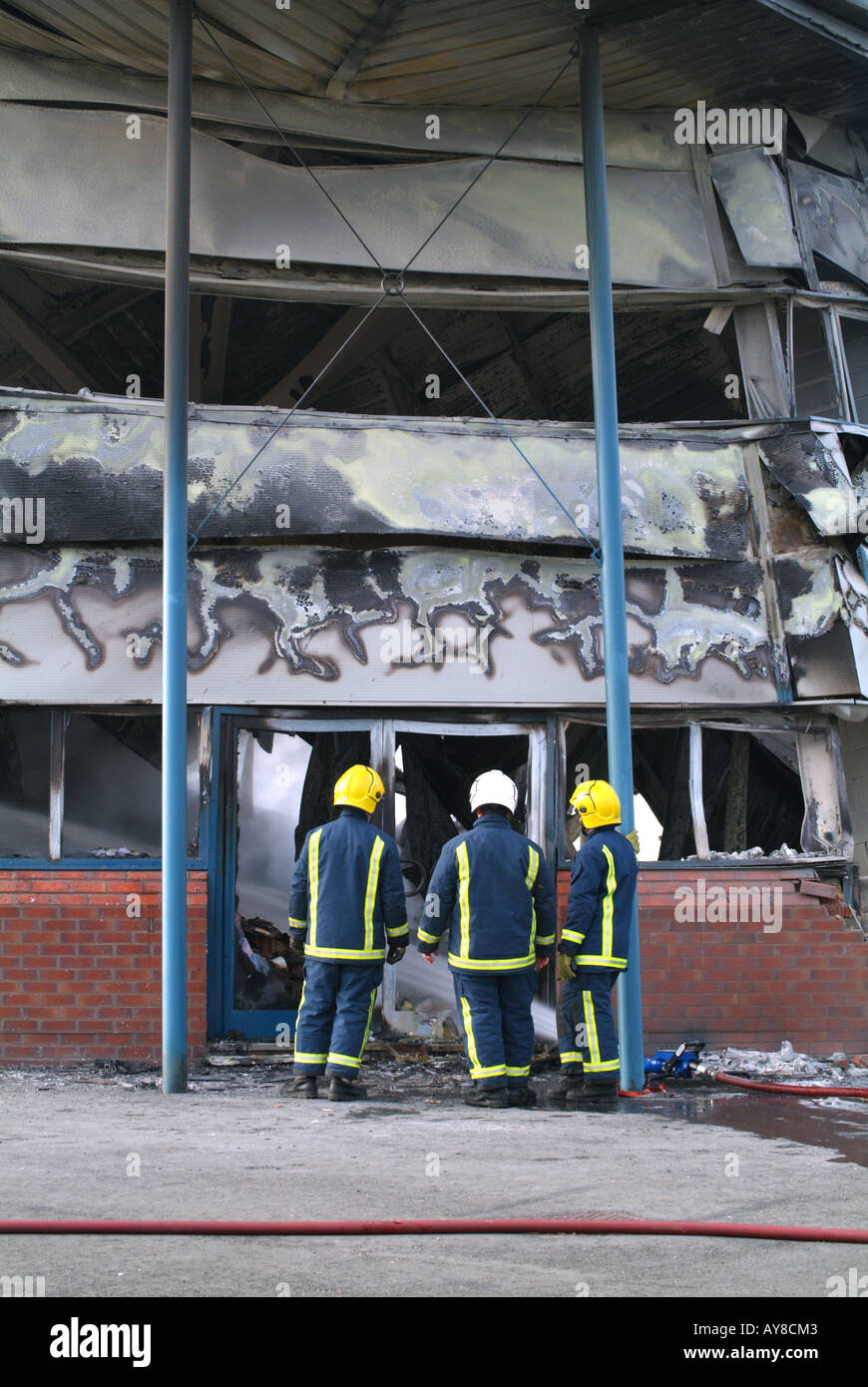 FIREMAN FIGHTING FIRE AT A FACTORY IN ENGLAND Stock Photo - Alamy