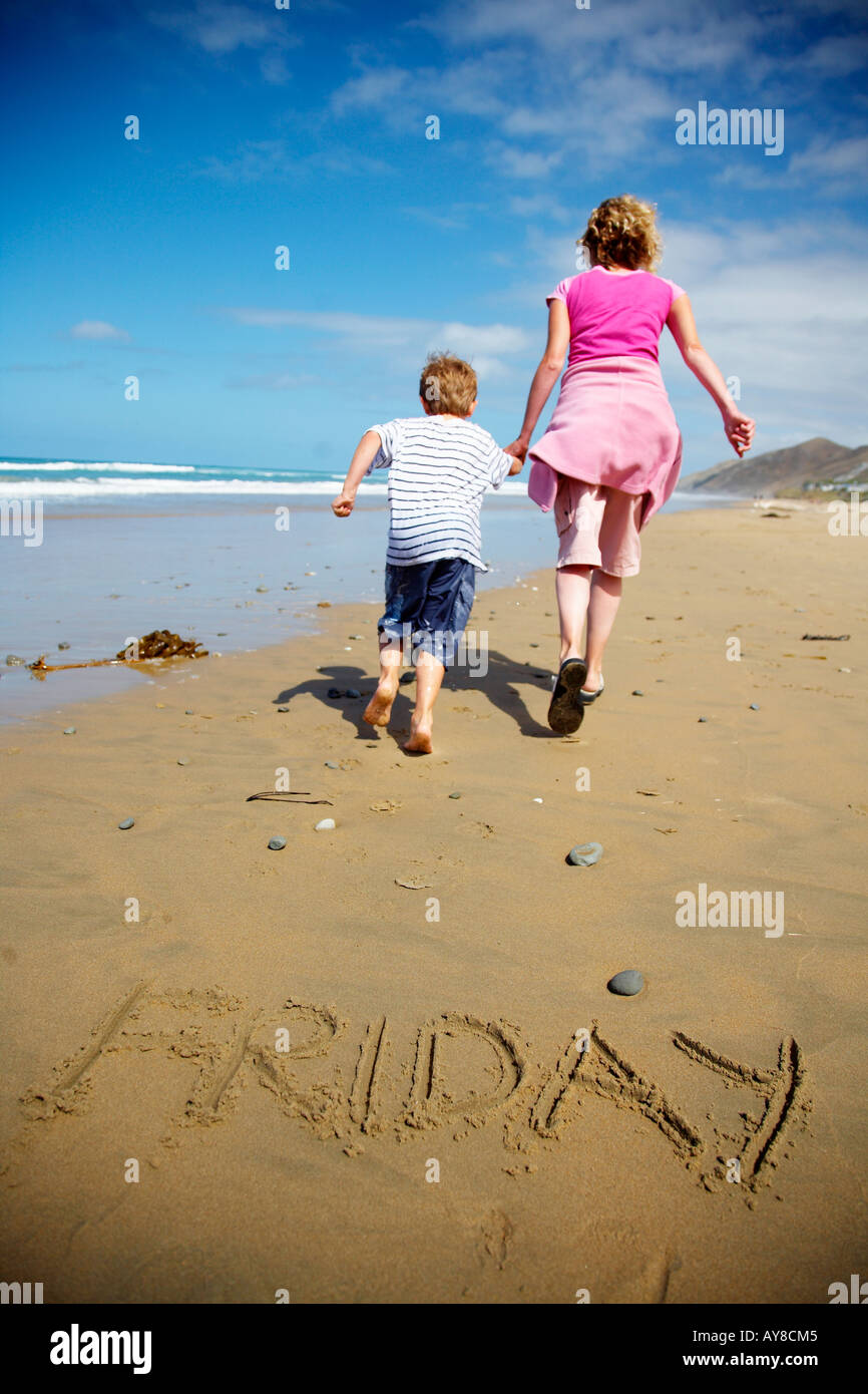 the word friday drawn in the sand with people running away ready for ...