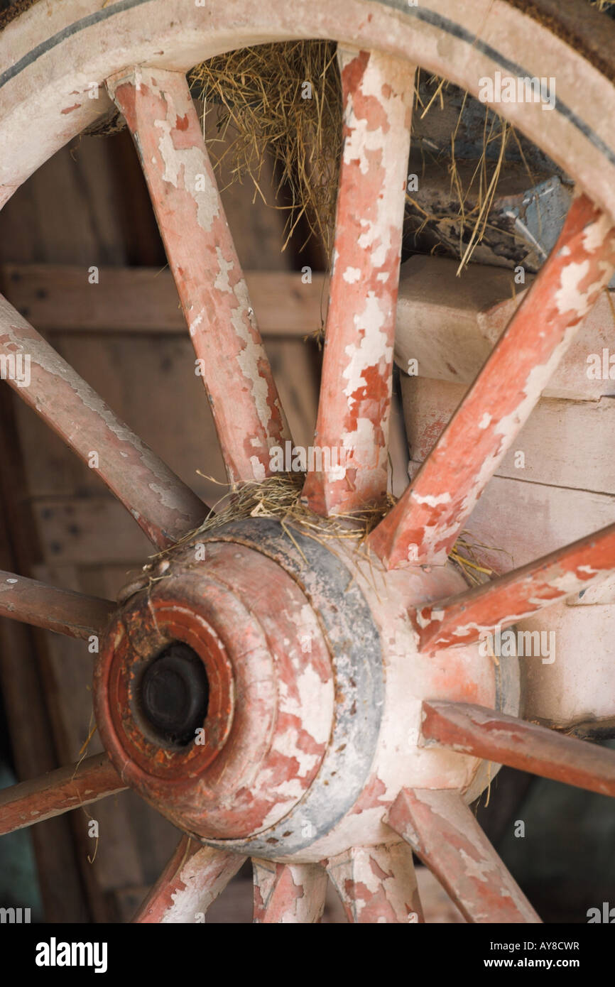Close up of an old rustic vintage wooden cart wheel showing wooden ...