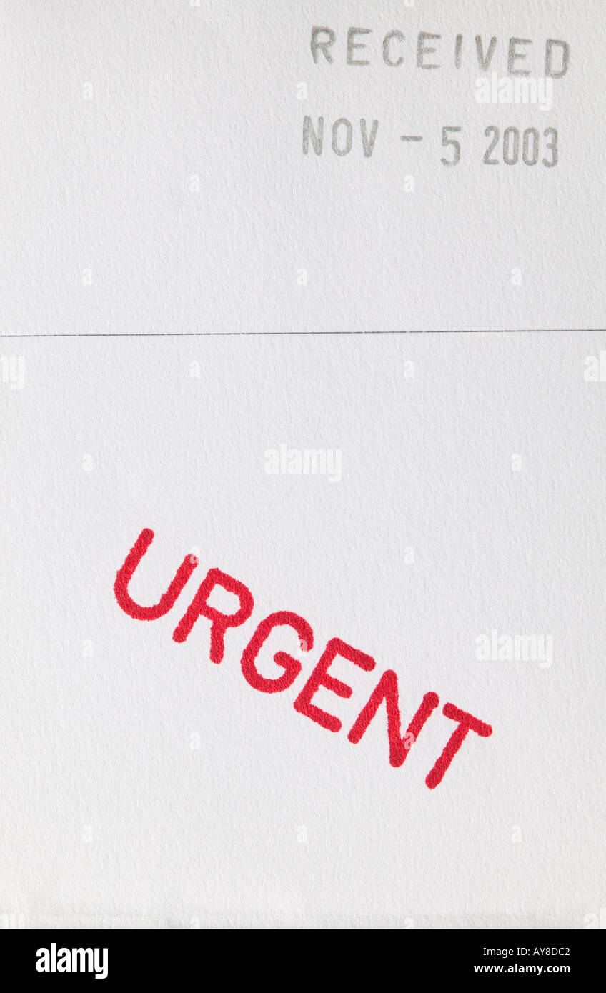 Urgent paperwork on office desk Stock Photo - Alamy