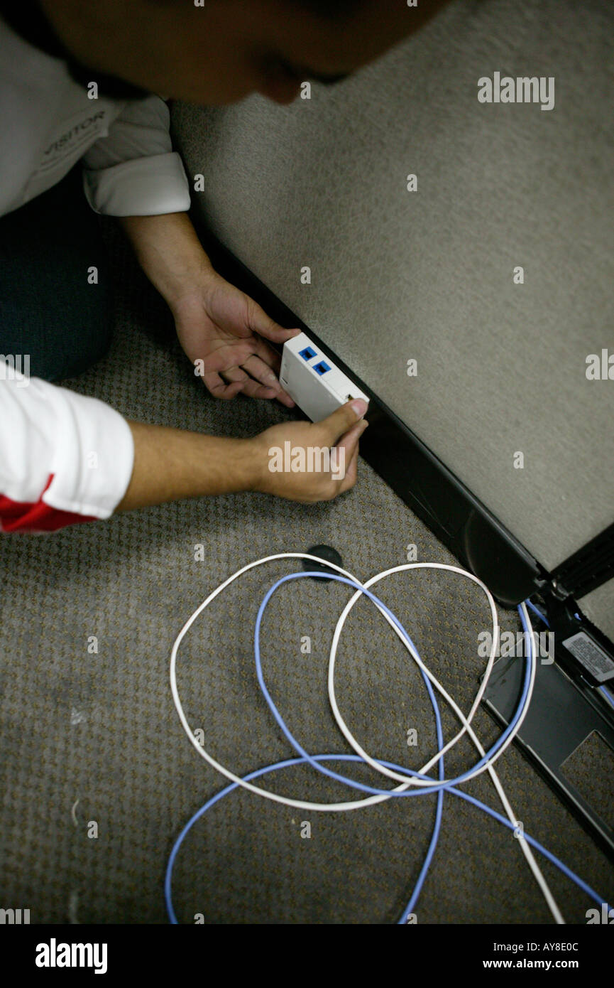 Instalation of ethernet cable in highrise office building Stock Photo ...
