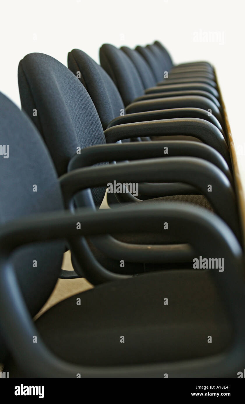 Empty row of chairs in conference room at highrise office building ...
