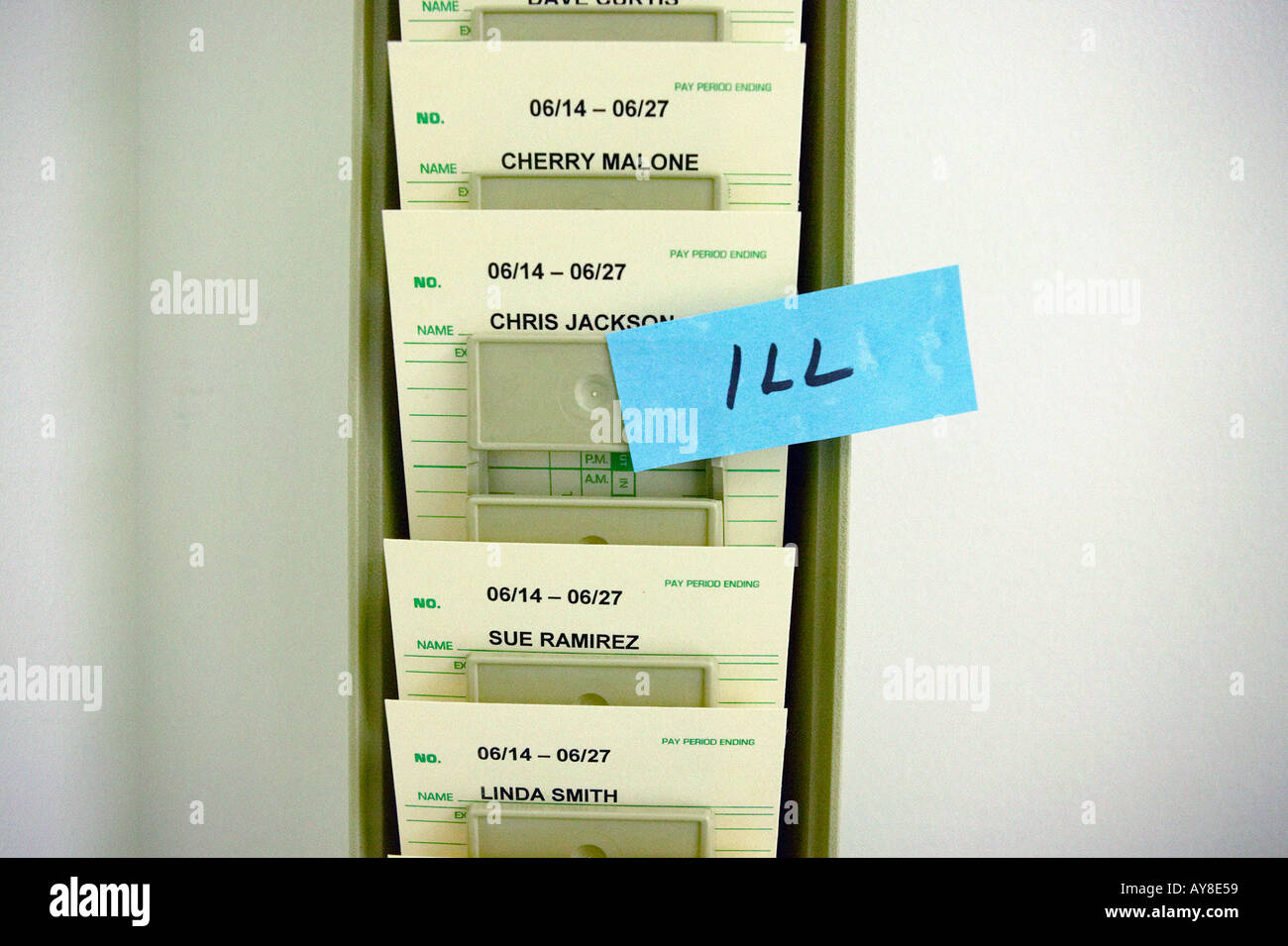 Row of employee time cards with one missing and marked ILL Stock Photo ...