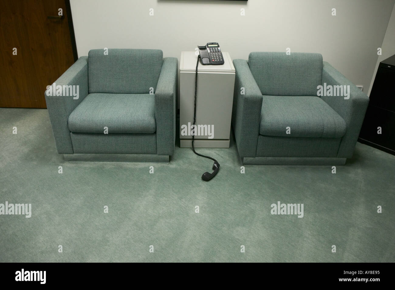 Phone is off the hook in office reception area Stock Photo - Alamy