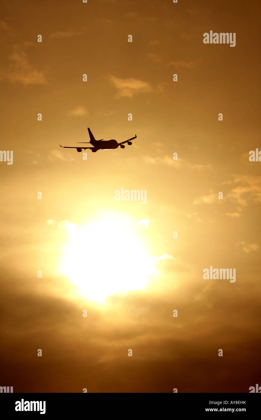Boeing 747 Jumbo jet taking off at sunset Stock Photo - Alamy