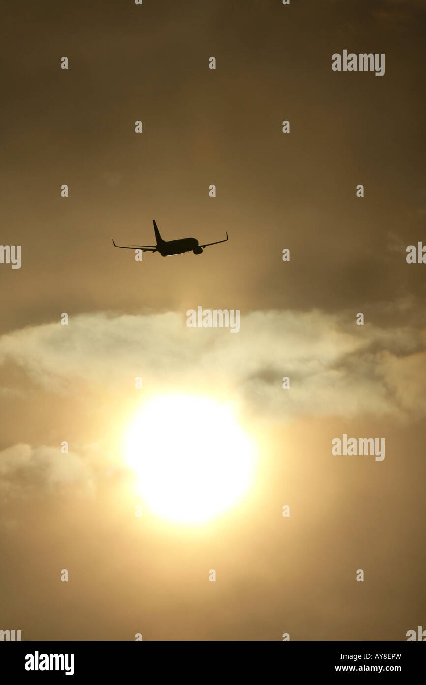 Boeing 737 taking off at sunset Stock Photo - Alamy