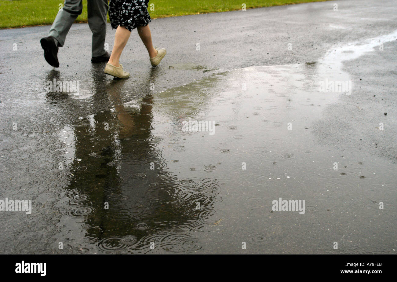 Man running pouring rain hi-res stock photography and images - Alamy