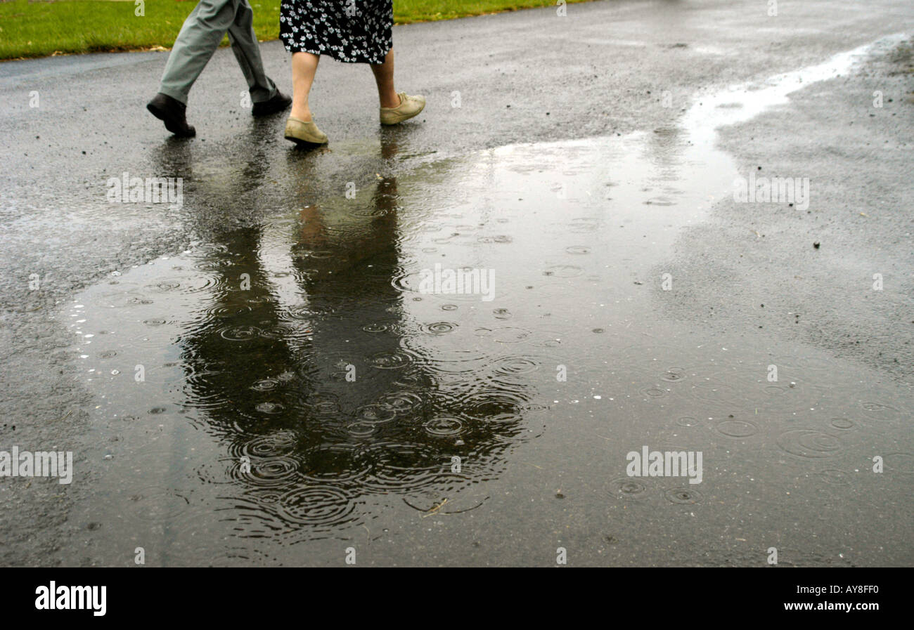 Man running pouring rain hi-res stock photography and images - Alamy