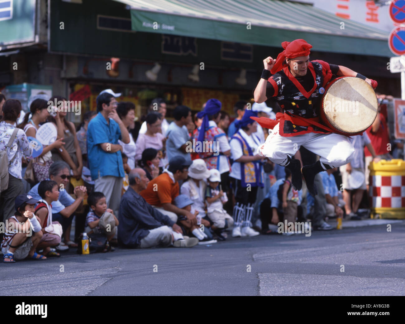 Drummer jumps into the air at the 10,000 man Eisa festival on ...