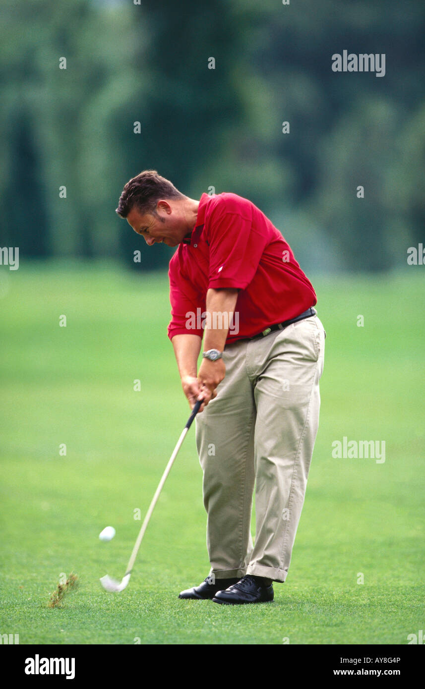 Male golfer in action Stock Photo - Alamy