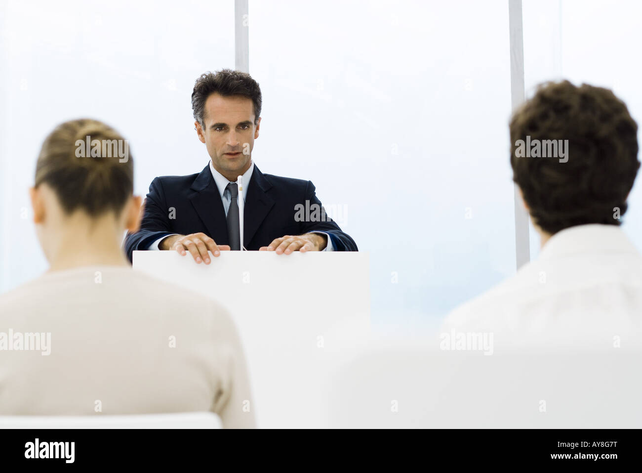 Businesswoman speaking from lectern hi-res stock photography and images ...