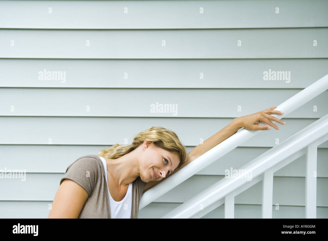 Woman Leaning Against Railings High Resolution Stock Photography and ...