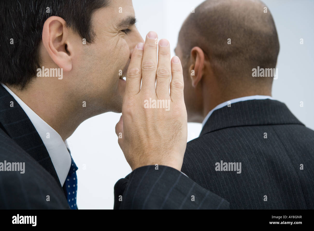 Businessmen whispering hi-res stock photography and images - Alamy