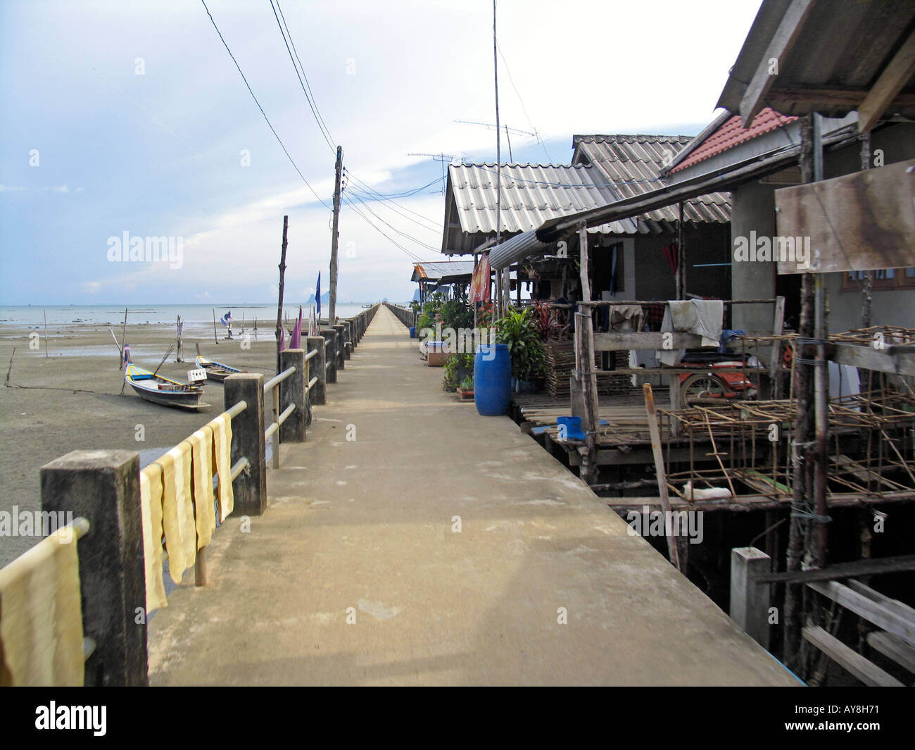 Fishermens houses at Ban Batu village line Naban Pier low water Ko ...