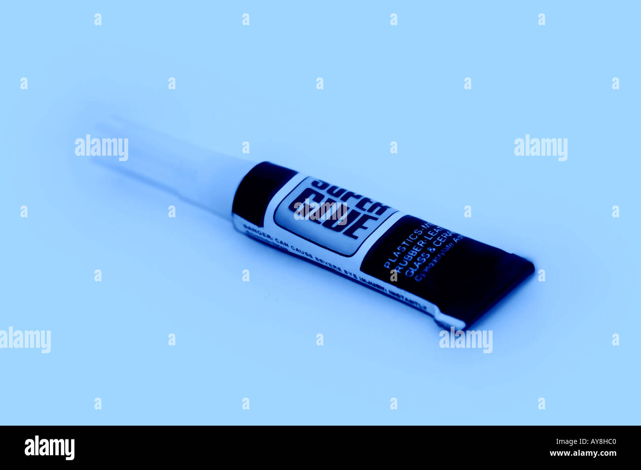 A tube of Superglue adhesive with blue toning Stock Photo - Alamy