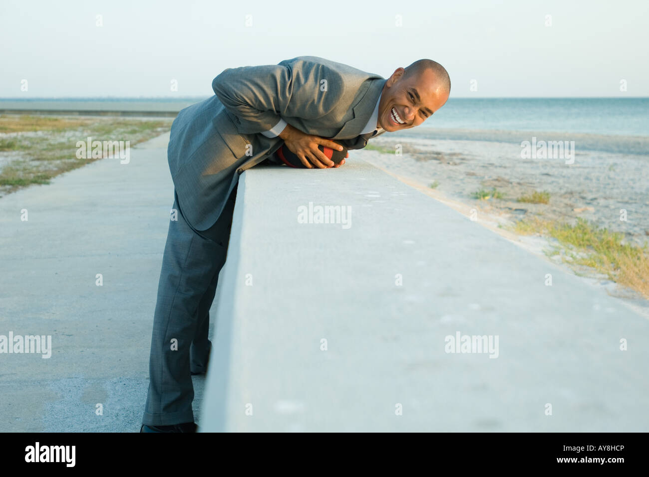 Businessman leaning over low wall hi-res stock photography and images ...